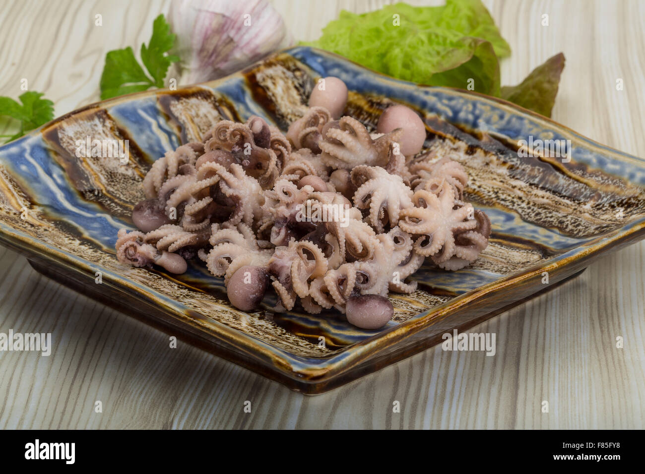 Boiled octopus - mini seafood in the bowl Stock Photo - Alamy