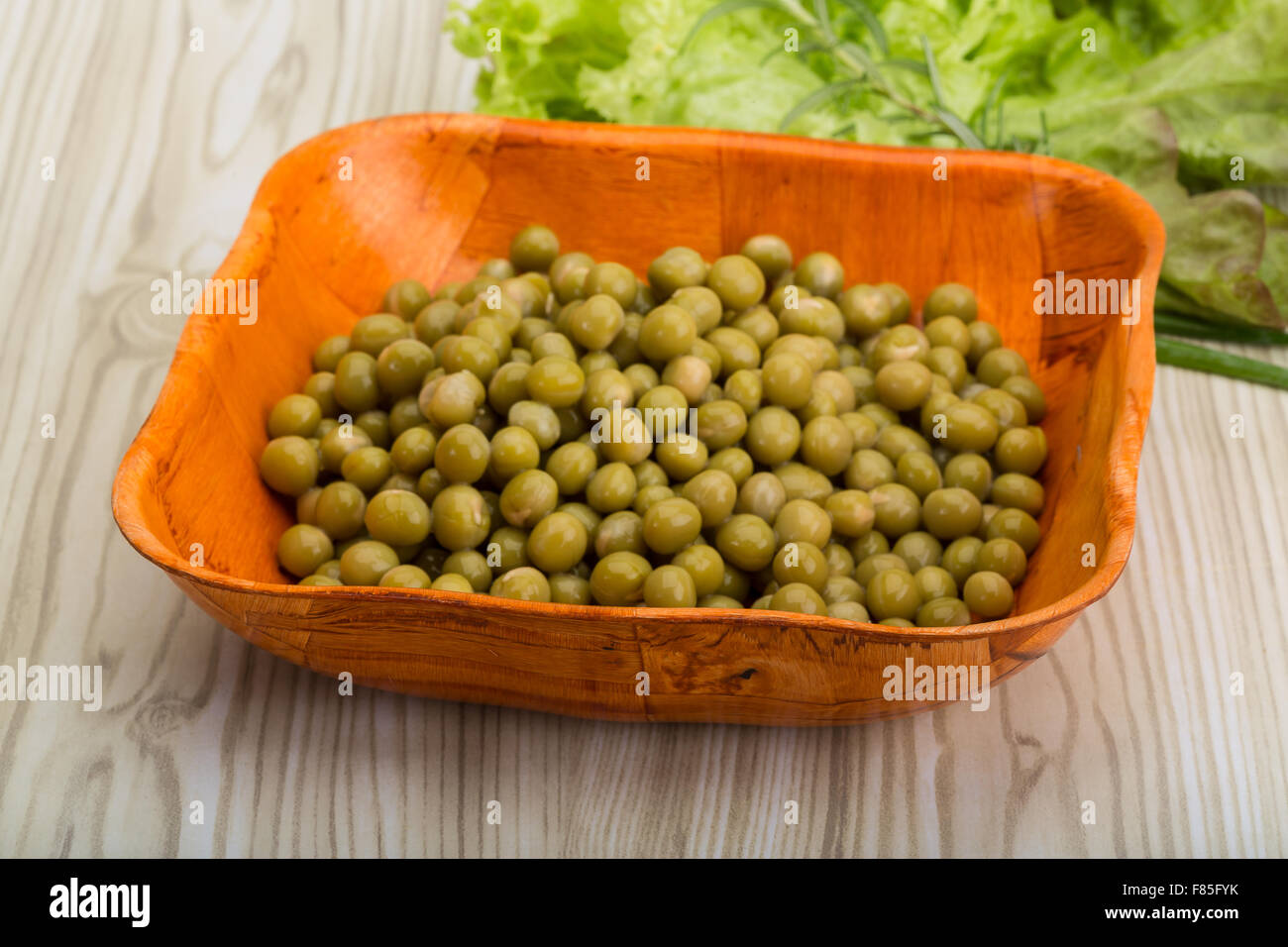 Marinated peas - in the bowl with salad leaves Stock Photo - Alamy