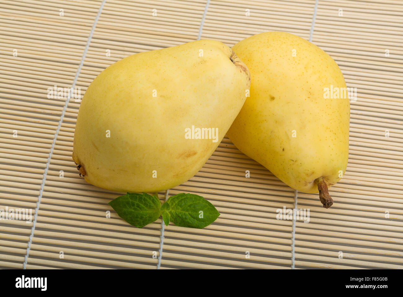 Bright ripe Yellow pears with mint leaves Stock Photo - Alamy
