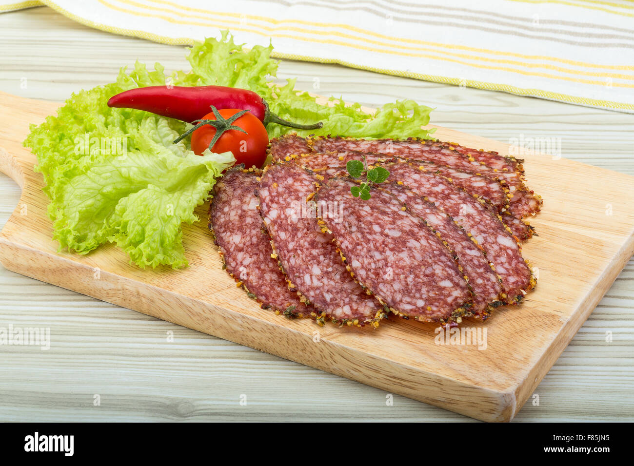 Sliced salami - with herbs and spices Stock Photo - Alamy