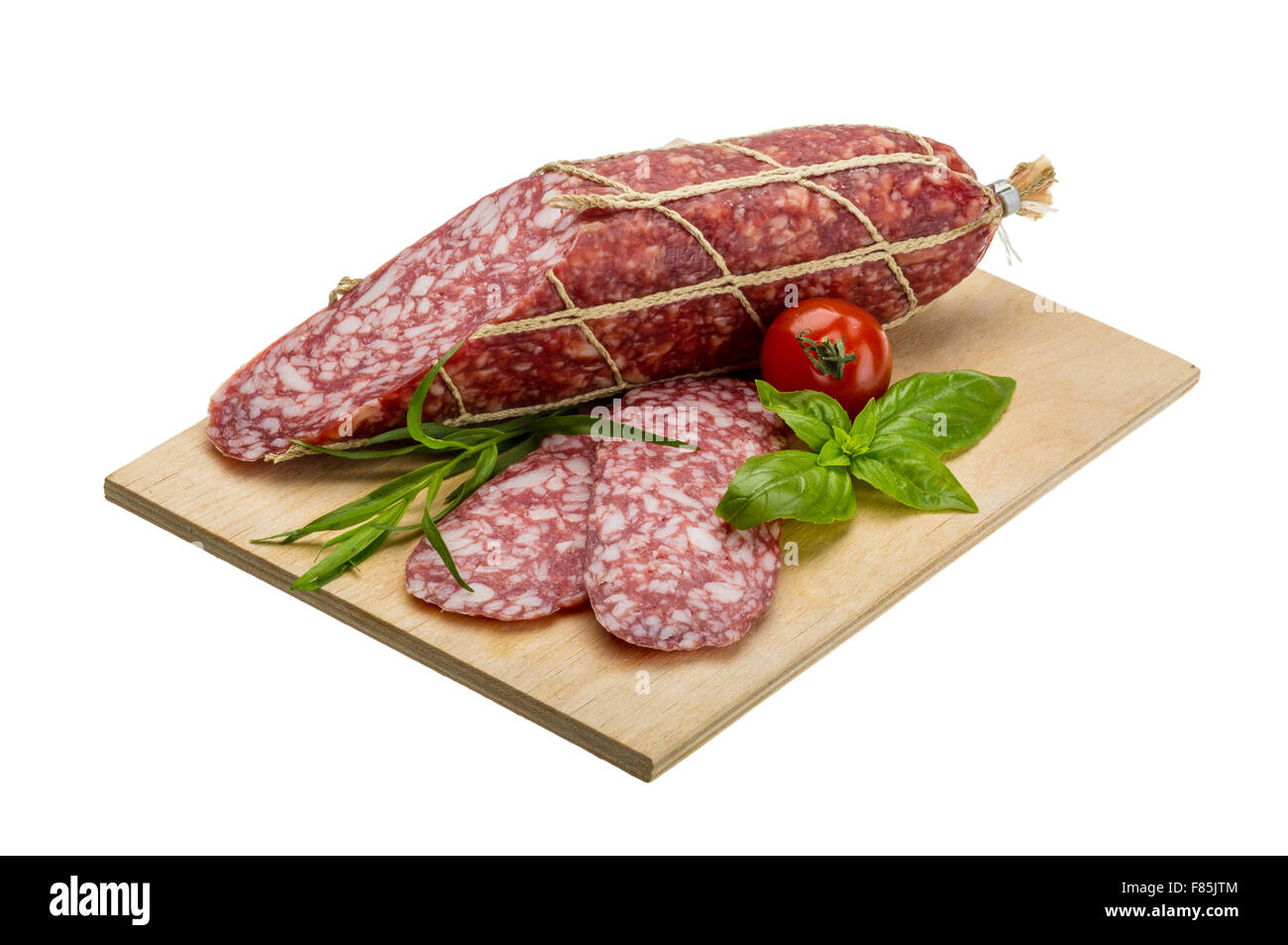 Salami sausages sliced with basil Stock Photo - Alamy
