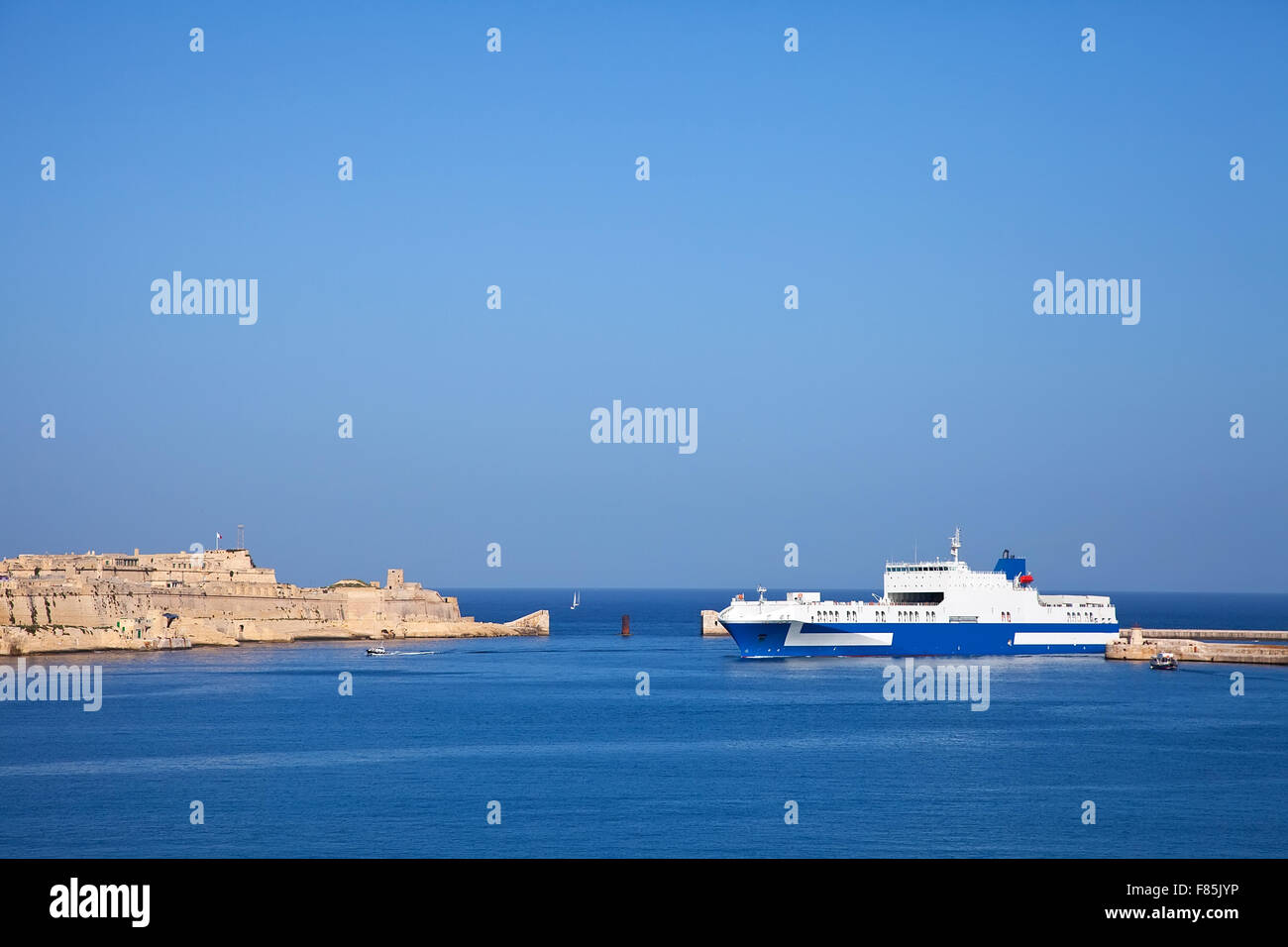 Cargo ship going in to Grand harbour (Valleta, Malta Stock Photo - Alamy