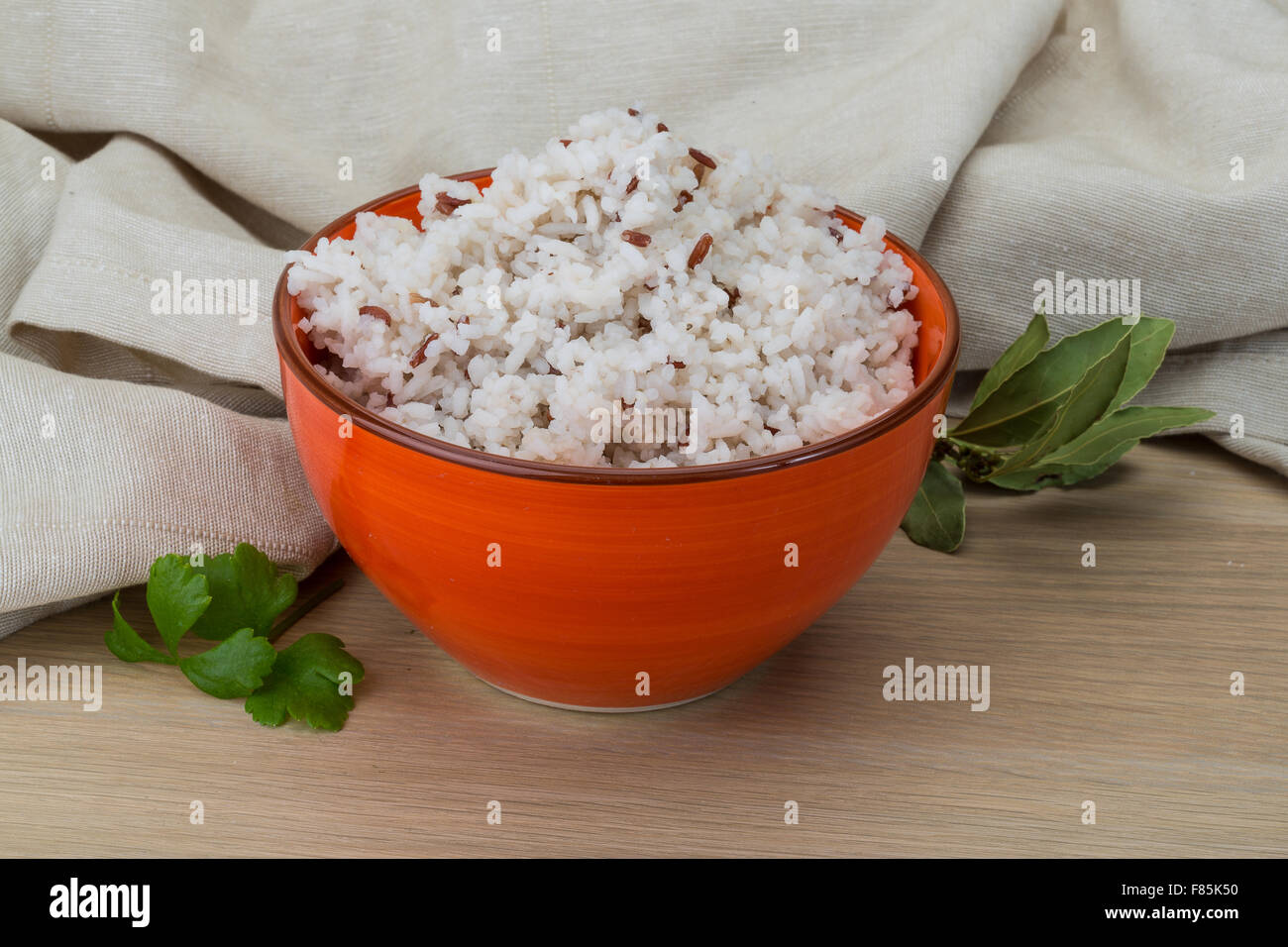 Boiled rice in the bowl on wooden background Stock Photo - Alamy