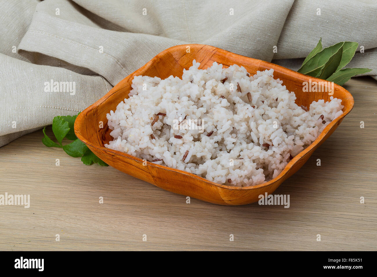 Boiled rice in the bowl on wooden background Stock Photo - Alamy