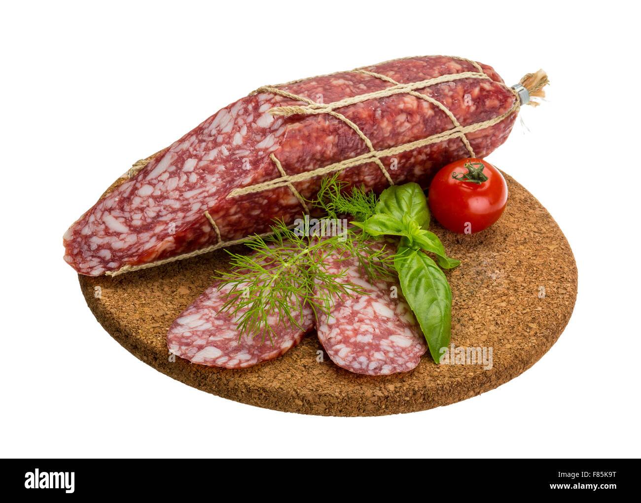 Salami sausages sliced with basil Stock Photo - Alamy