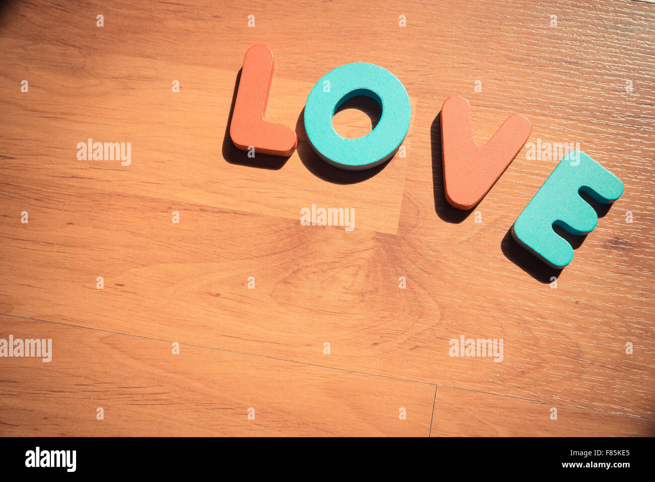Wooden word LOVE on laminate floor 4 Stock Photo - Alamy
