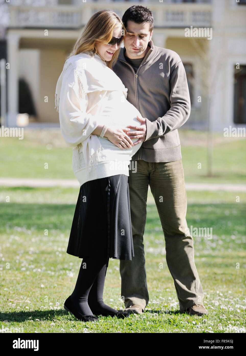 happy young married family couple outdoor in nature have fun and ...