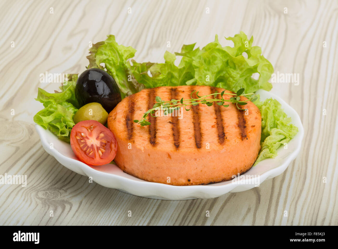 Grilled Fish cakes in the bowl with salad leaves Stock Photo - Alamy