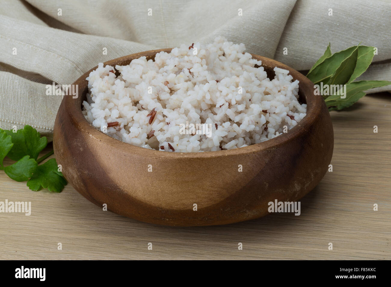 Boiled rice in the bowl on wooden background Stock Photo - Alamy