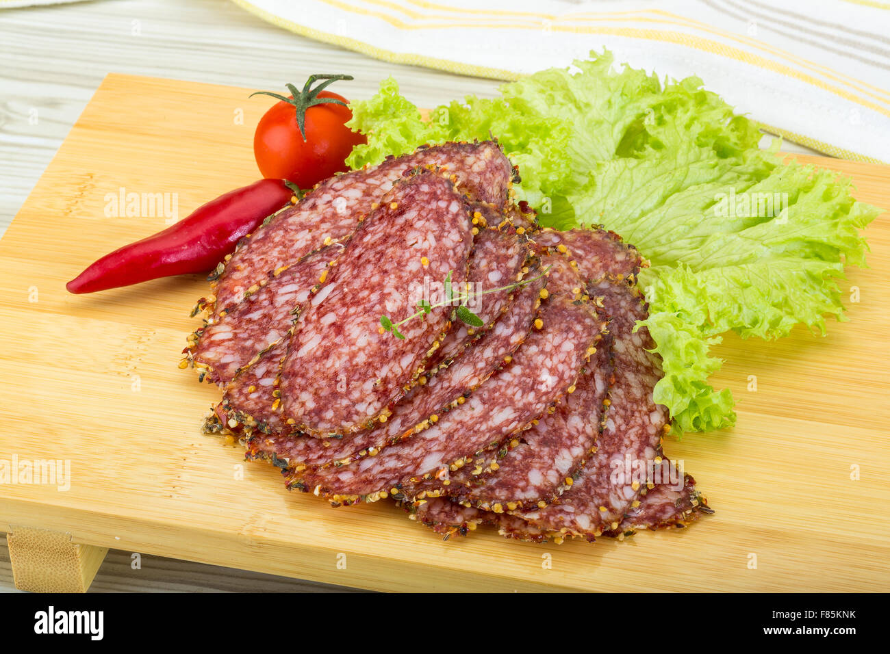 Sliced salami - with herbs and spices Stock Photo - Alamy