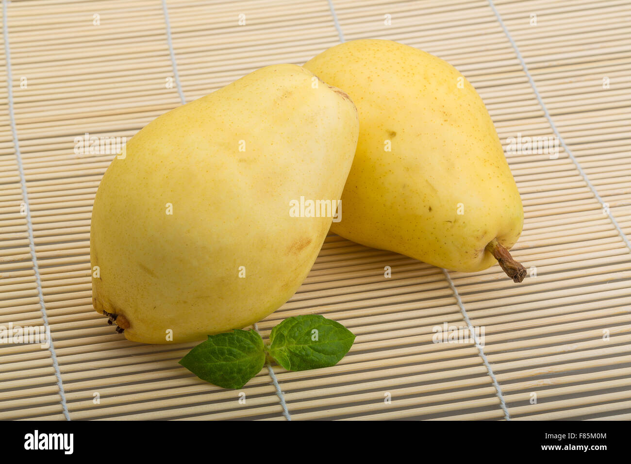 Bright ripe Yellow pears with mint leaves Stock Photo - Alamy