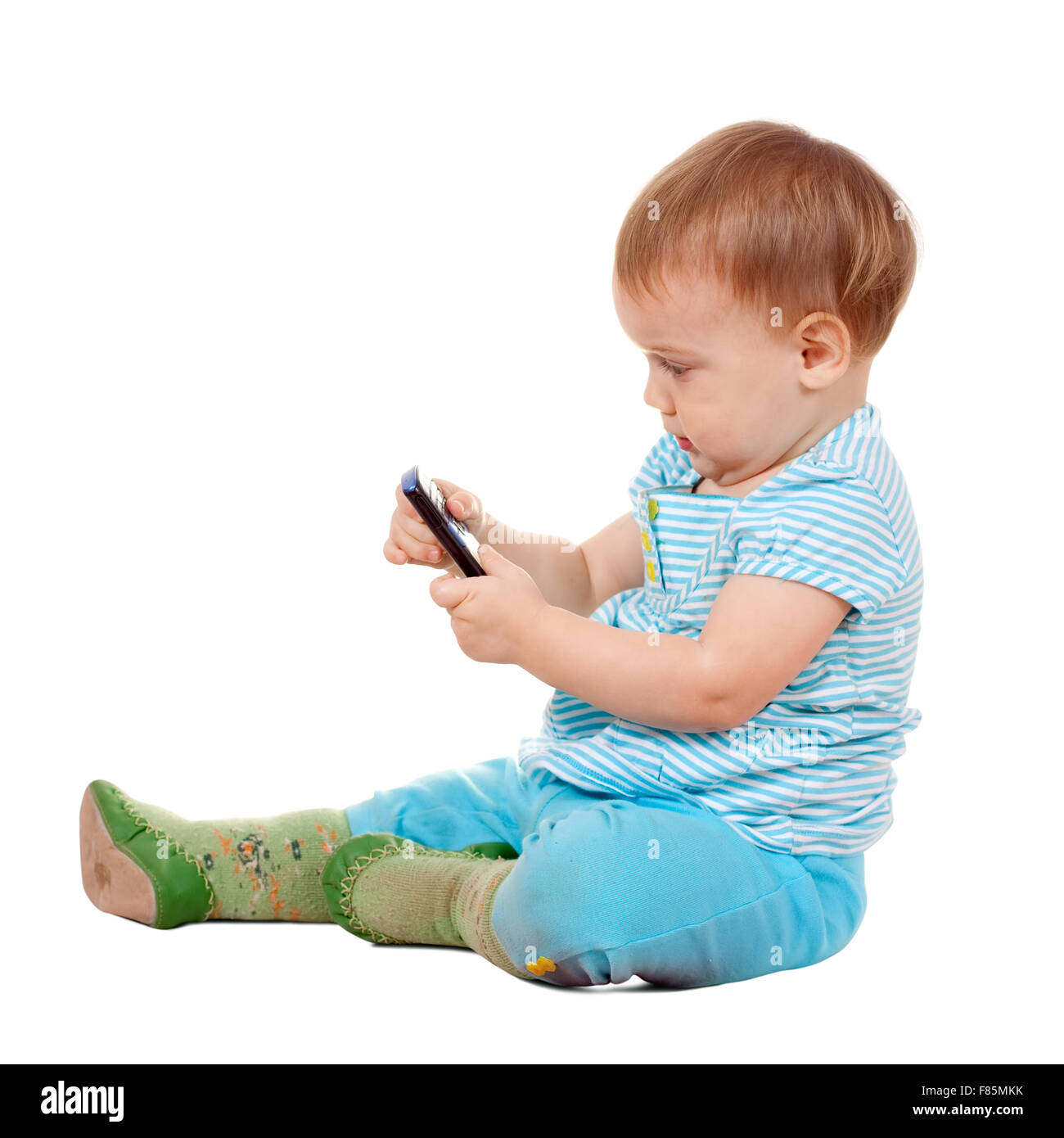 Toddler using mobile phone over white background Stock Photo - Alamy