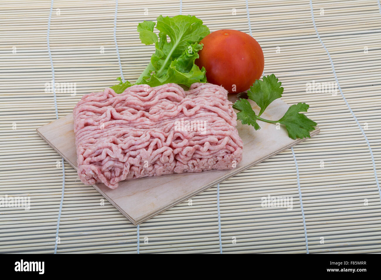 Raw minced pork meat on the desk with herbs Stock Photo - Alamy
