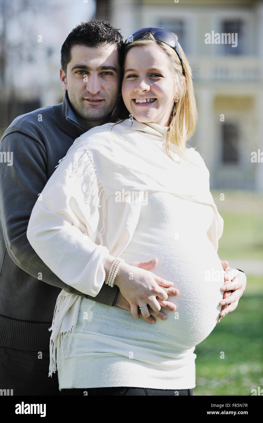 happy young married family couple outdoor in nature have fun and ...