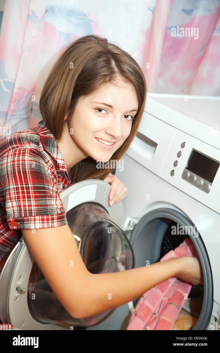 Teenager loading washing machine hi-res stock photography and images ...