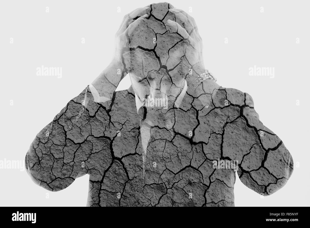 double exposure of depressed business man and dry ground background ...