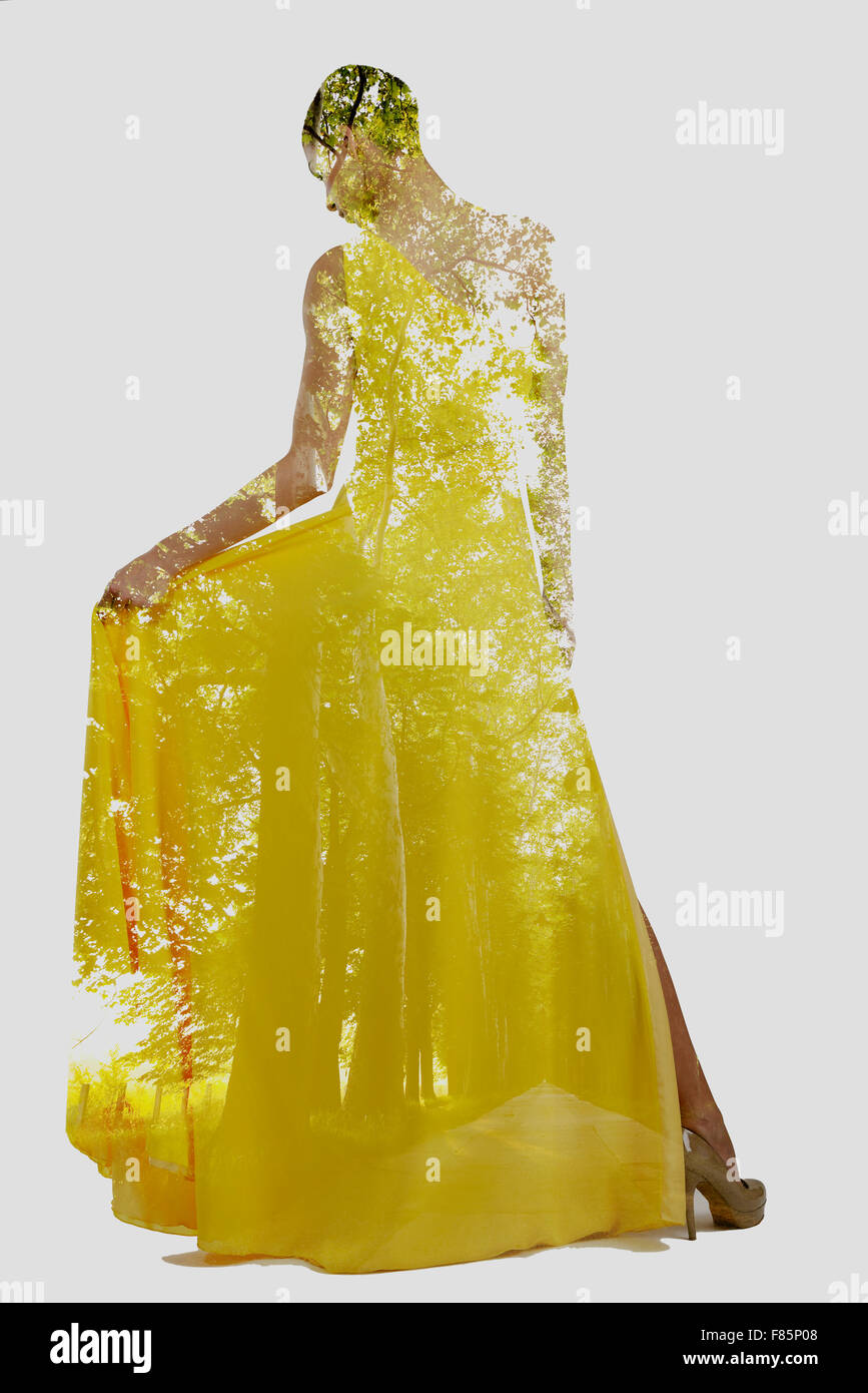 double exposure of woman in fashion dress with nature tree branches ...