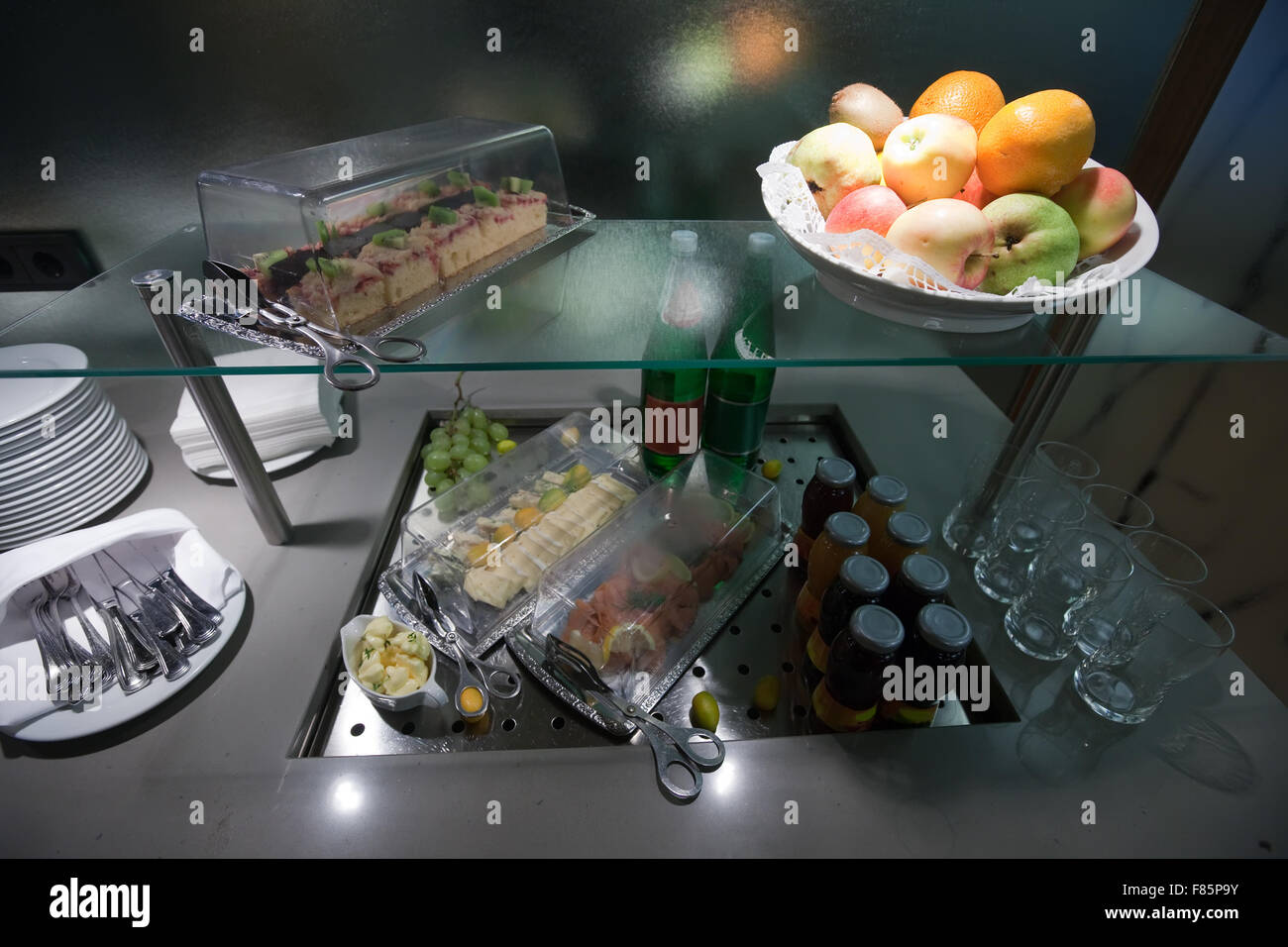 Buffet with cutlery and dessert Stock Photo - Alamy