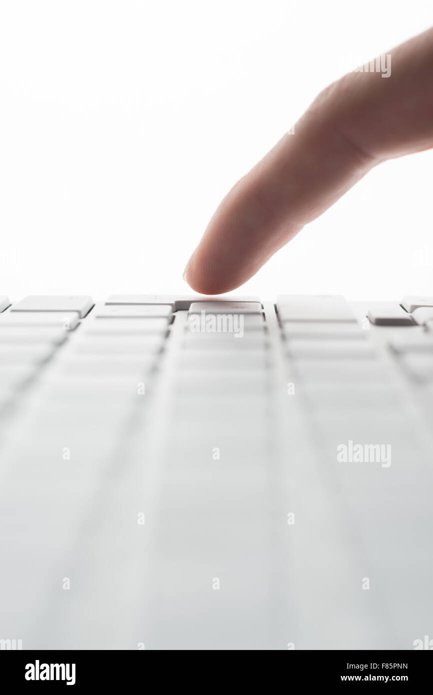Finger tap the Enter key of a keyboard Stock Photo - Alamy