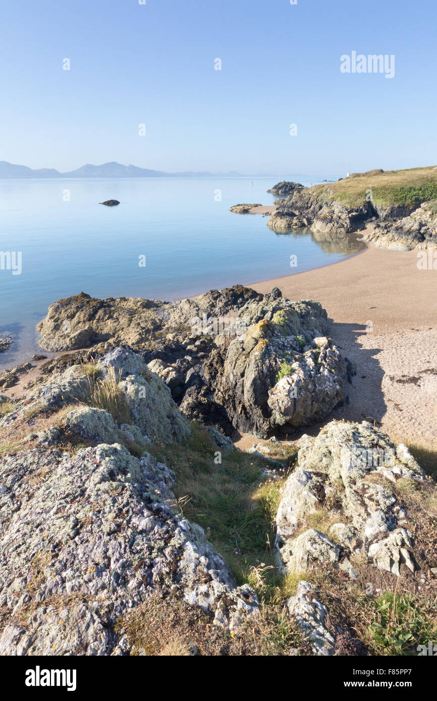 Volcanic rock and beach on Llanddwyn Island, Anglesey, Wales with the ...