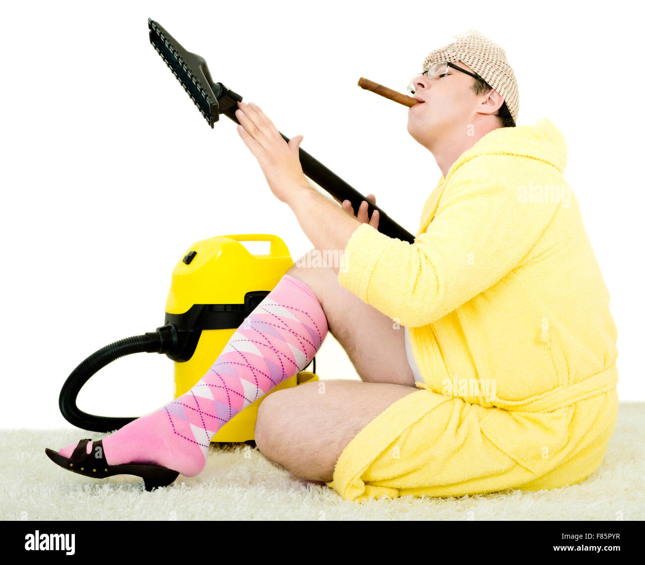 crazy carpet cleaner vacuuming with vacuum cleaner in the yellow robe ...