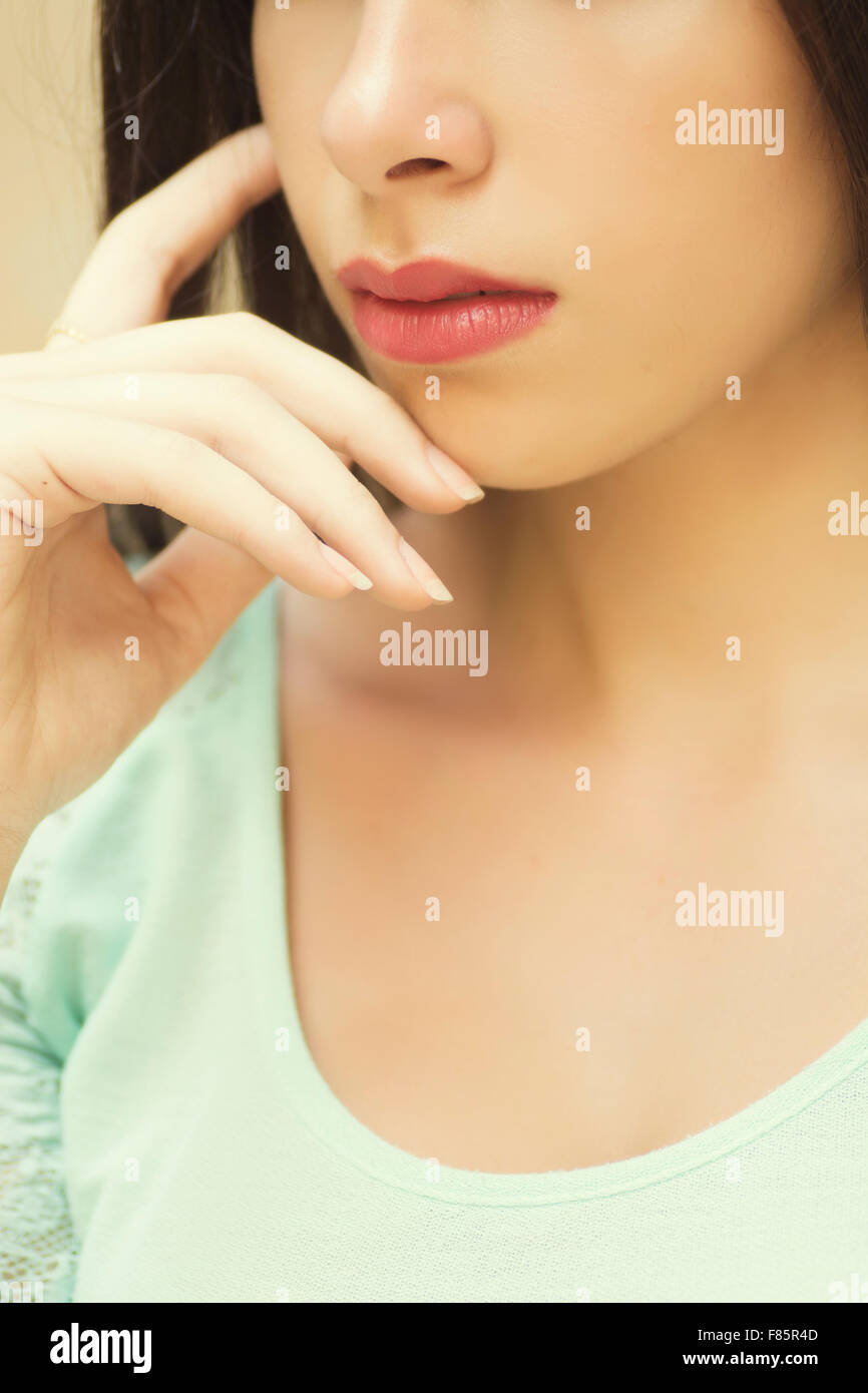 Close up of a young woman hand touching face Stock Photo - Alamy