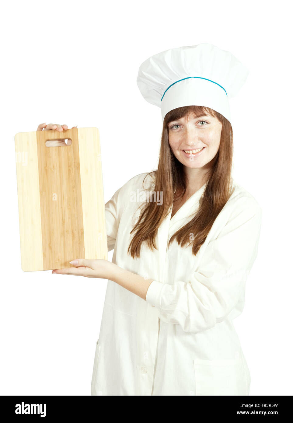 Portrait of female cook in white with cutting board over white Stock ...