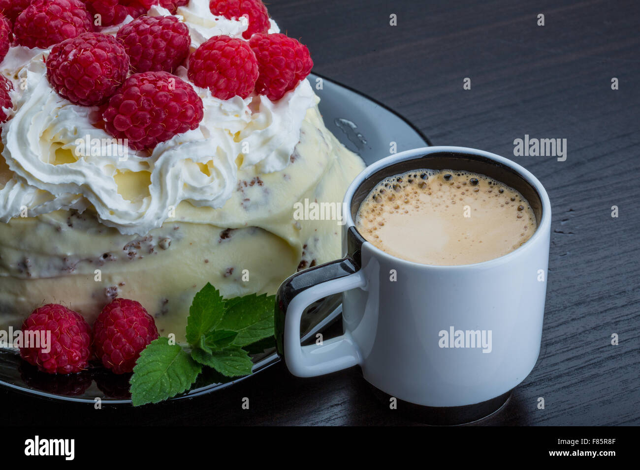 Coffee with raspberry cake and mint Stock Photo - Alamy