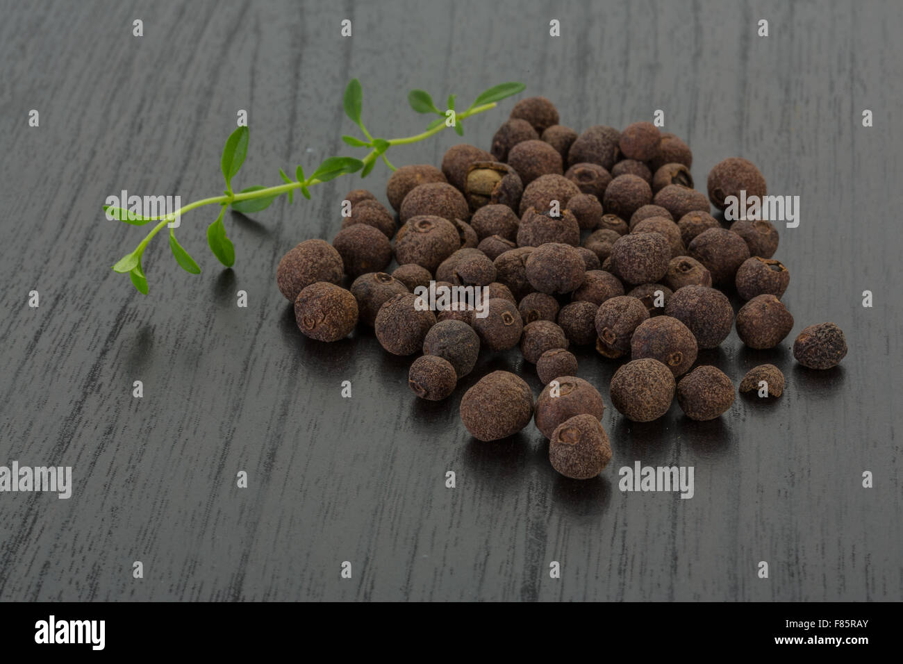 Black Pepper corn heap on the desk Stock Photo - Alamy