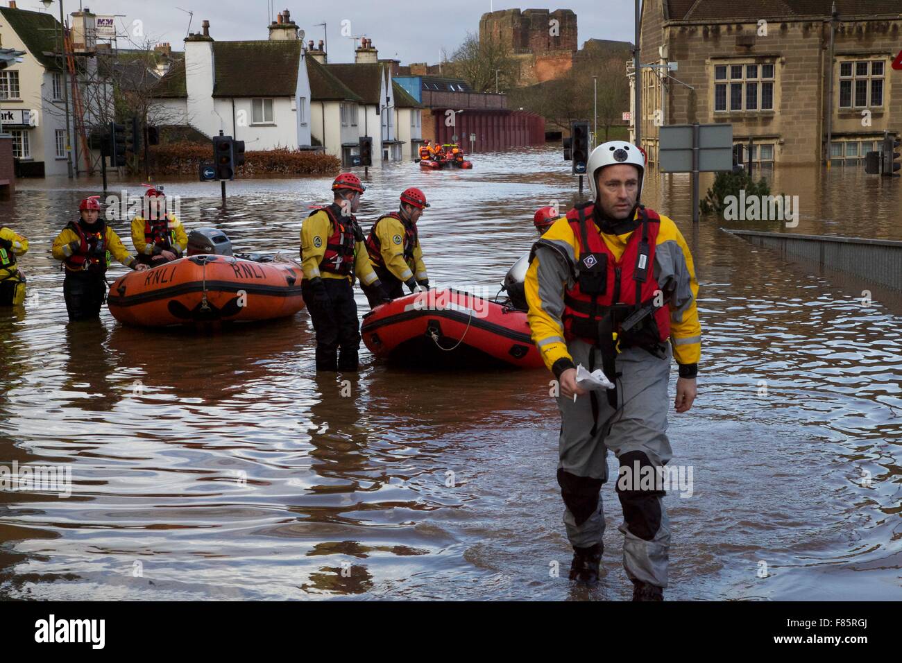Cumbria Floods. 6th December 2015. RNLI rescue team volunteer wading ...