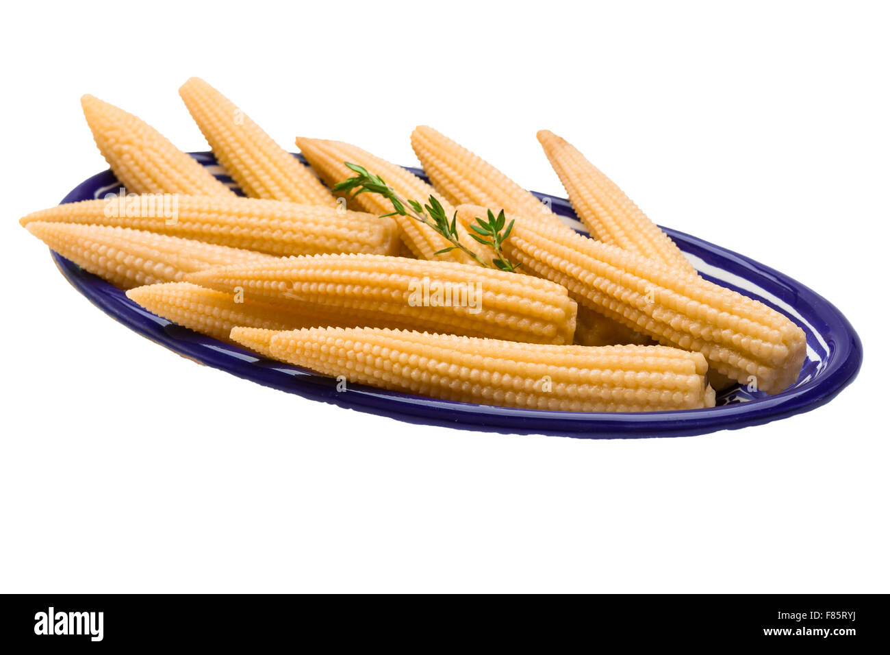 Baby corn with thyme Stock Photo - Alamy