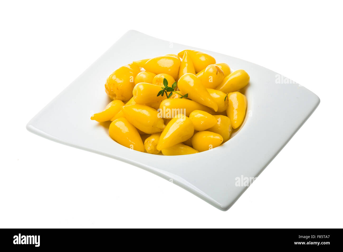 Marinated yellow pepper isolated Stock Photo - Alamy