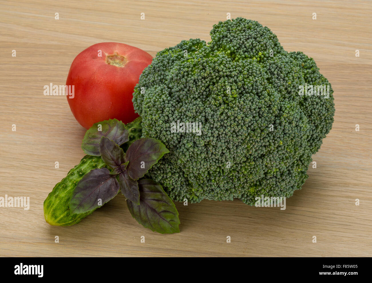 Fresh ripe broccoli with tomato and cucumber Stock Photo - Alamy