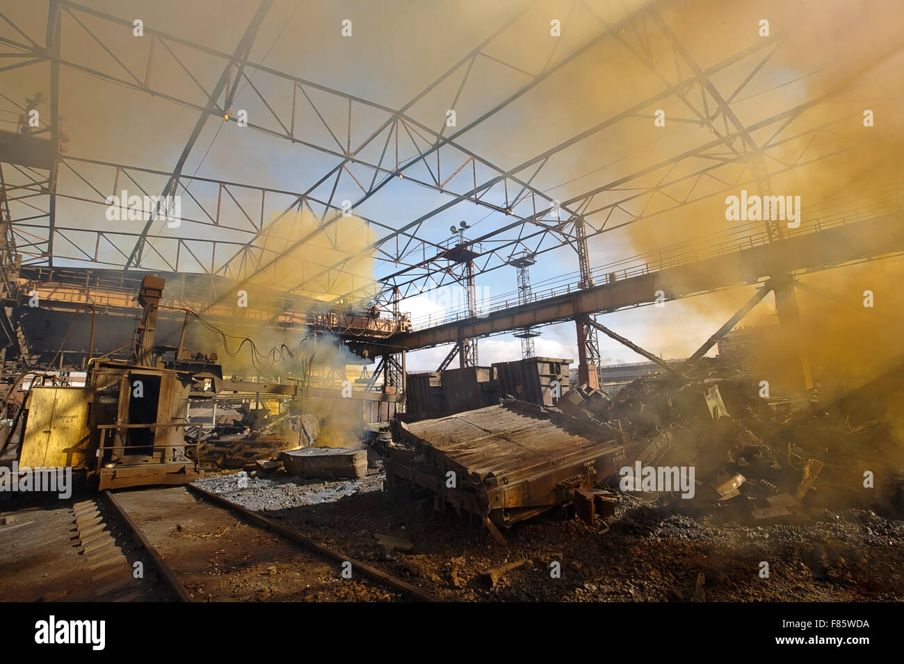 Scrap metal and smoke Stock Photo - Alamy