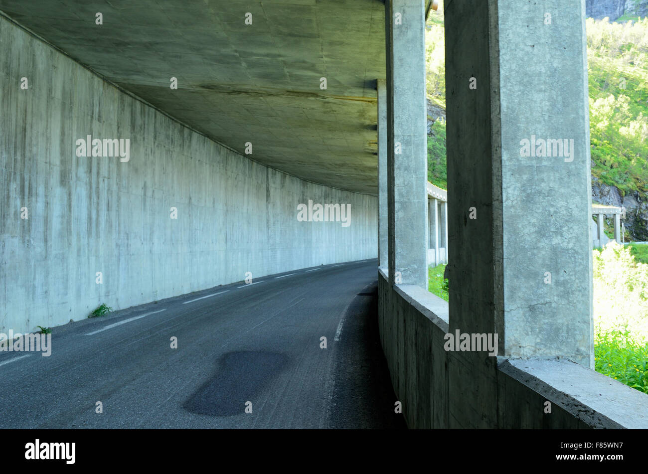 semi tunnel over road for falling rock protection Stock Photo - Alamy