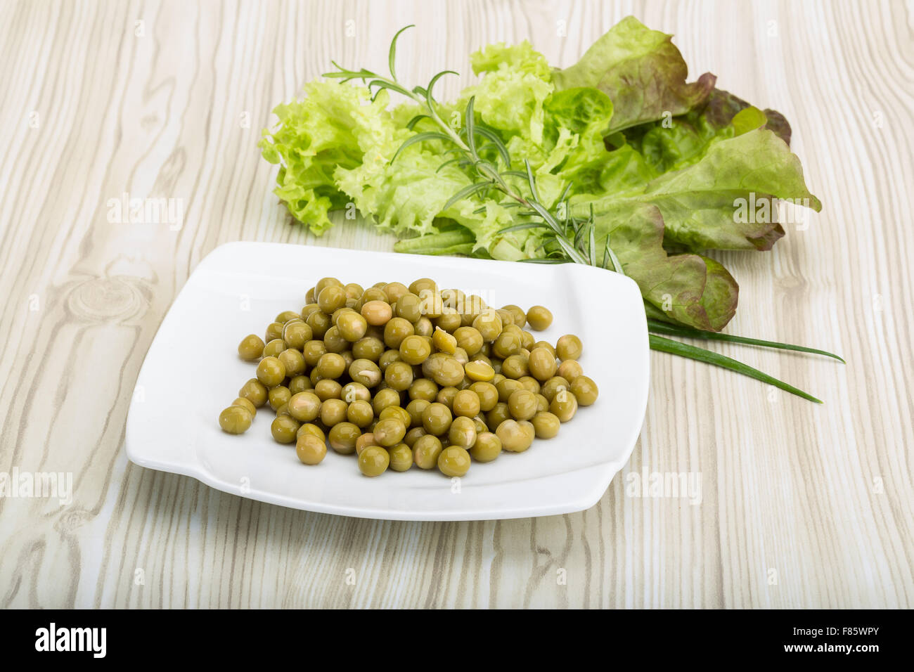 Marinated peas - in the bowl with salad leaves Stock Photo - Alamy