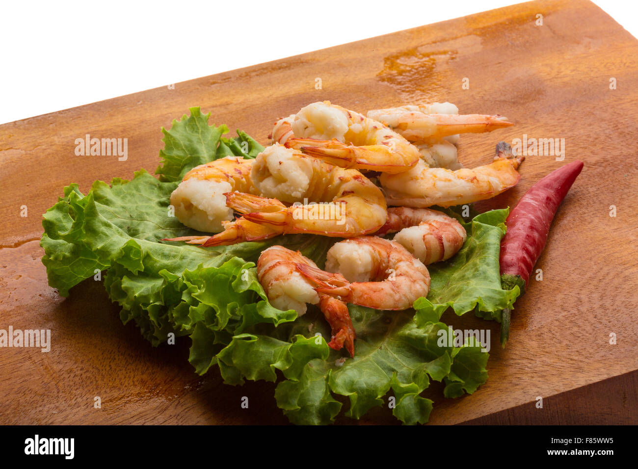 Unshelled king prawn heap with salad leaves Stock Photo - Alamy
