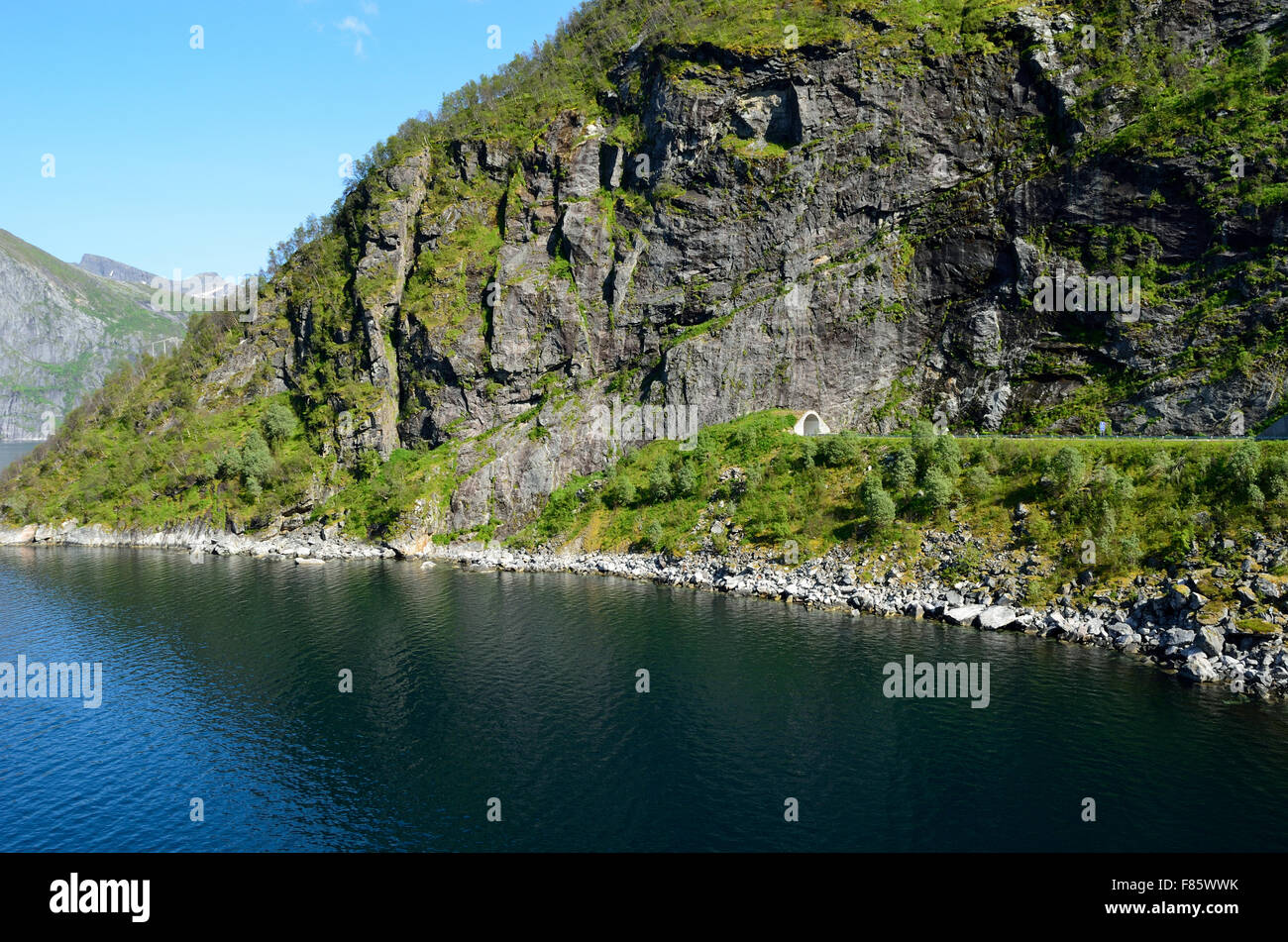 mountain tunnel and blue fjord landscape Stock Photo - Alamy