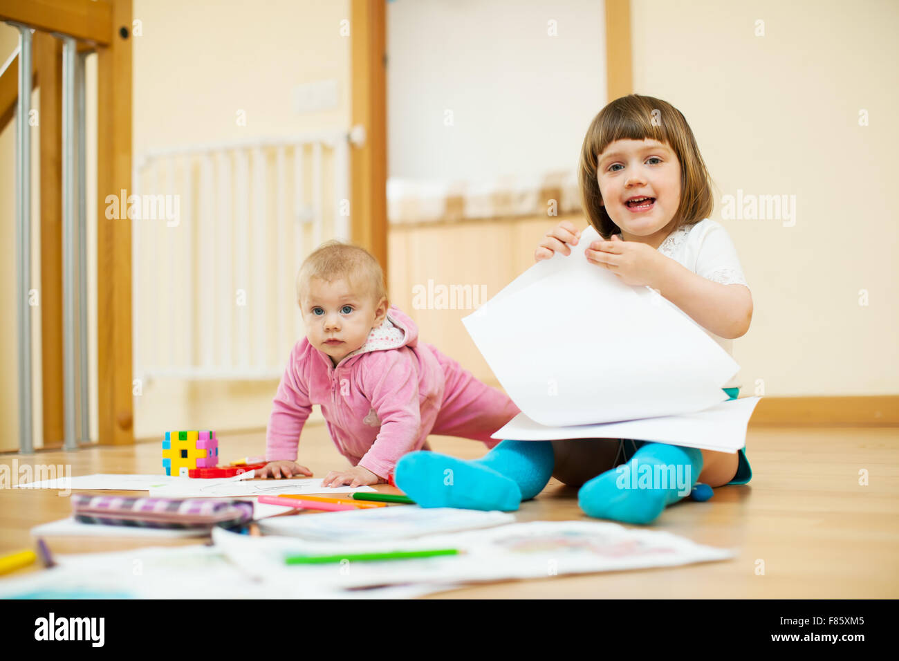 Two children playing together in home Stock Photo - Alamy