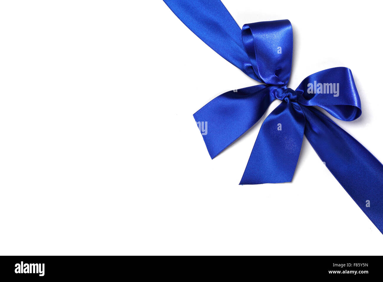 Shiny blue satin ribbon and bow isolated on white background Stock ...