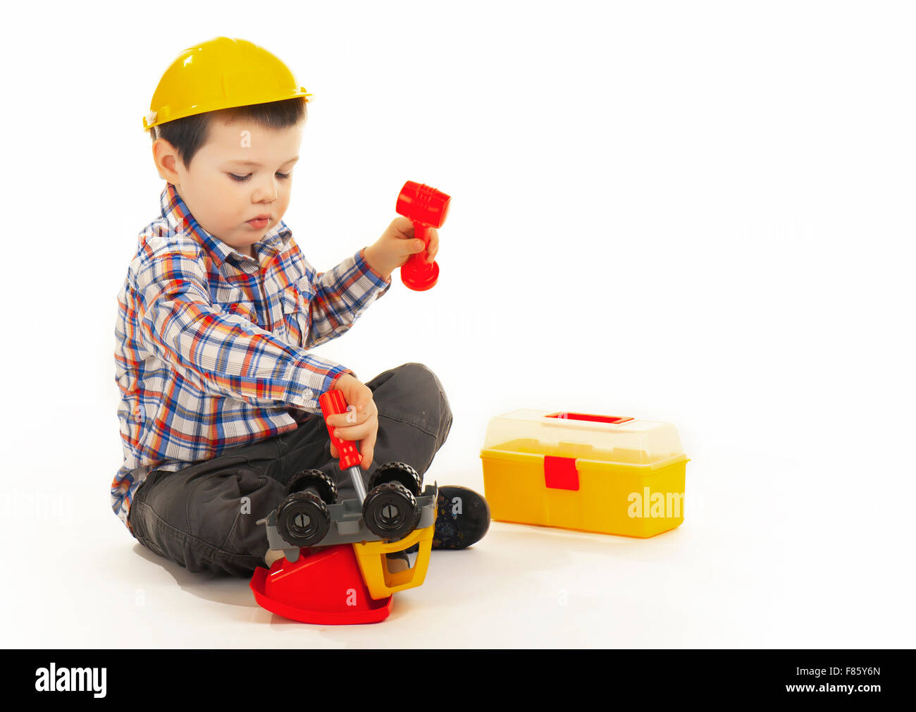 little boy fixing his toy Stock Photo - Alamy