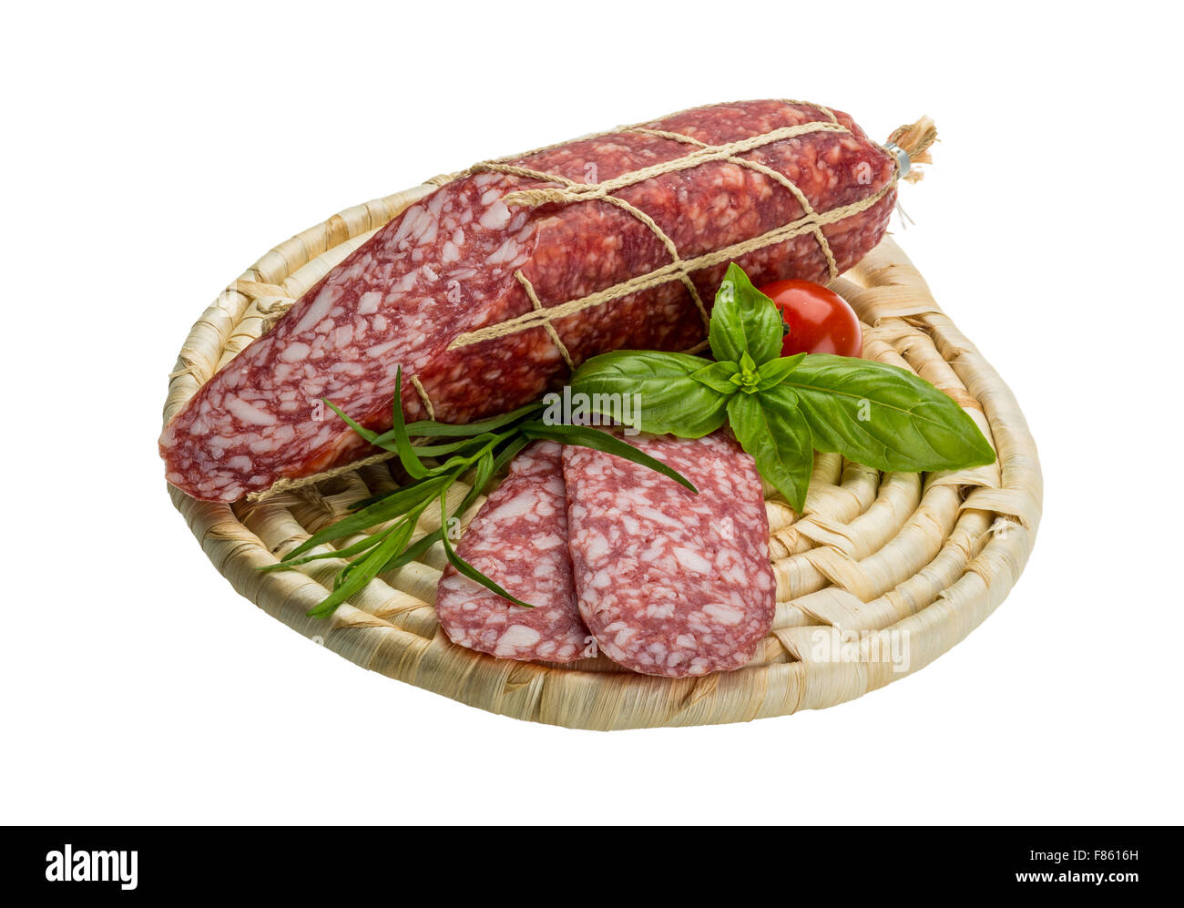 Salami sausages sliced with basil Stock Photo - Alamy