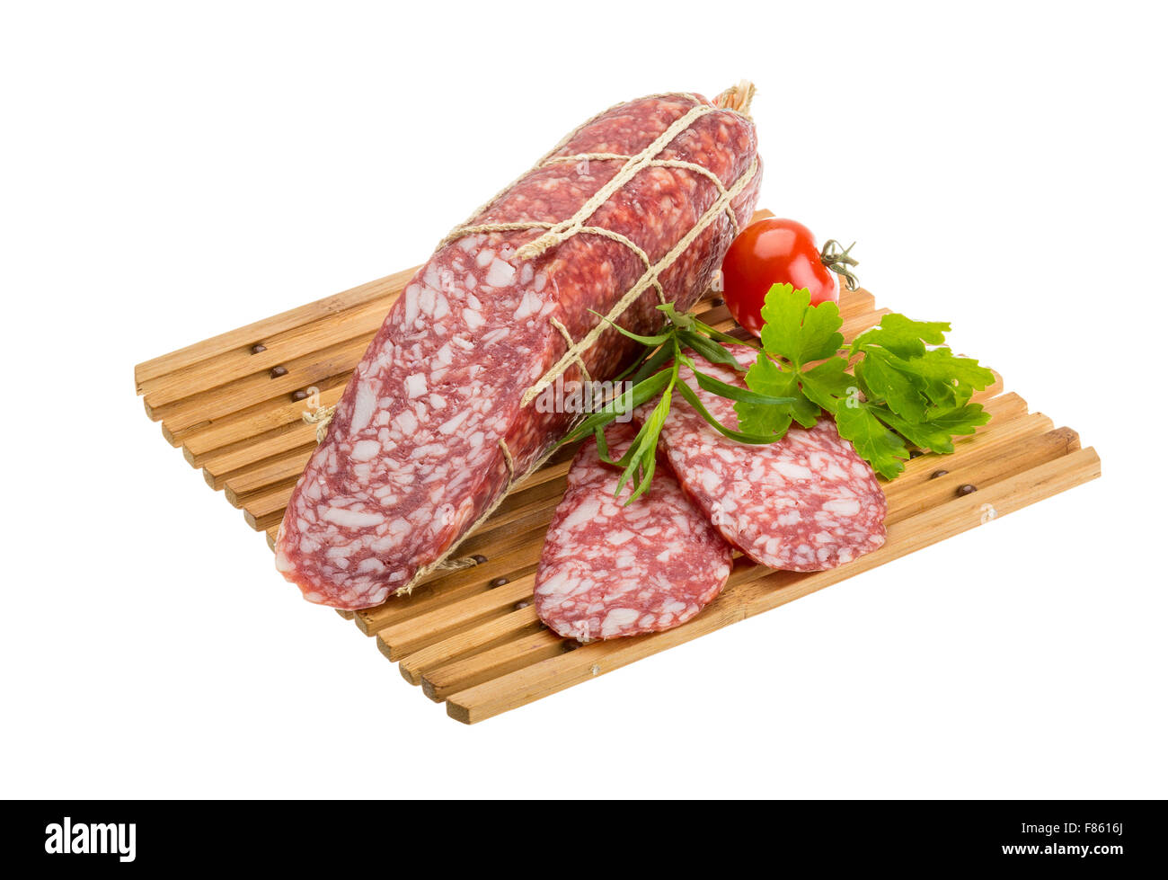 Salami sausages sliced with basil Stock Photo - Alamy
