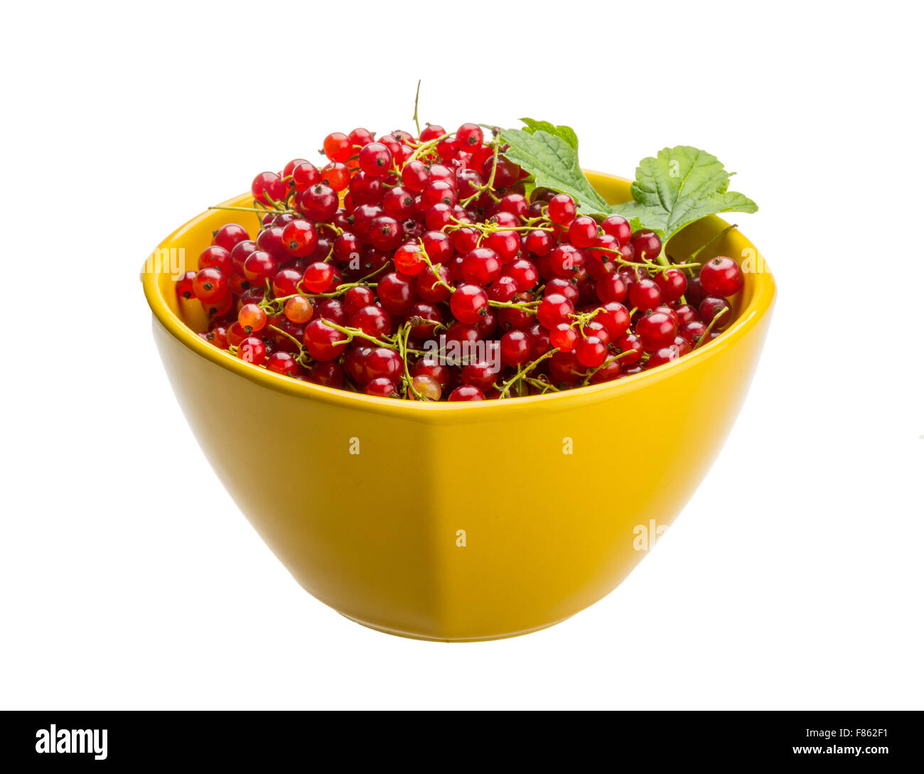 Red currant with leaf in the bowl Stock Photo - Alamy