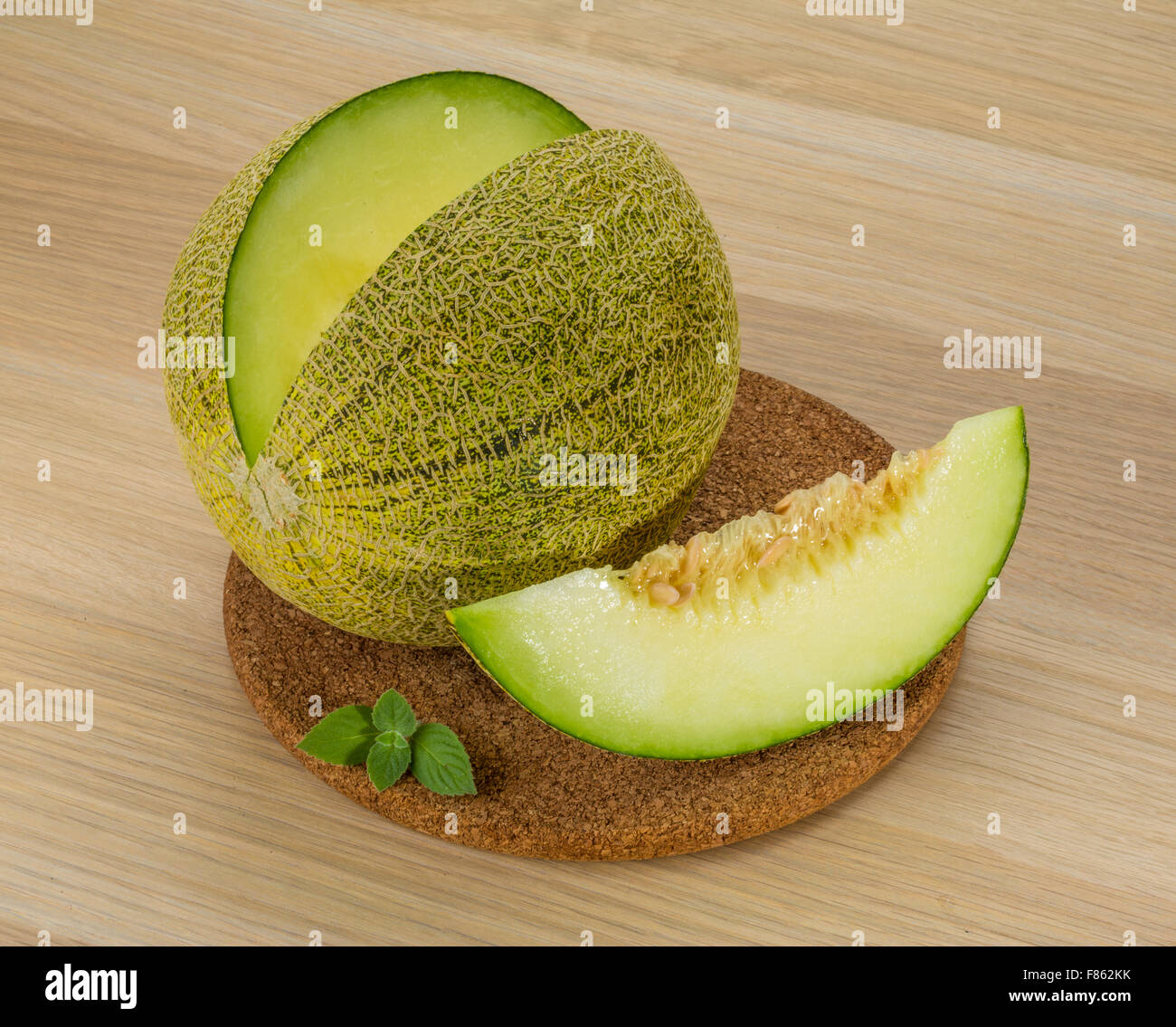 Fresh ripe melon sliced on the desk Stock Photo - Alamy
