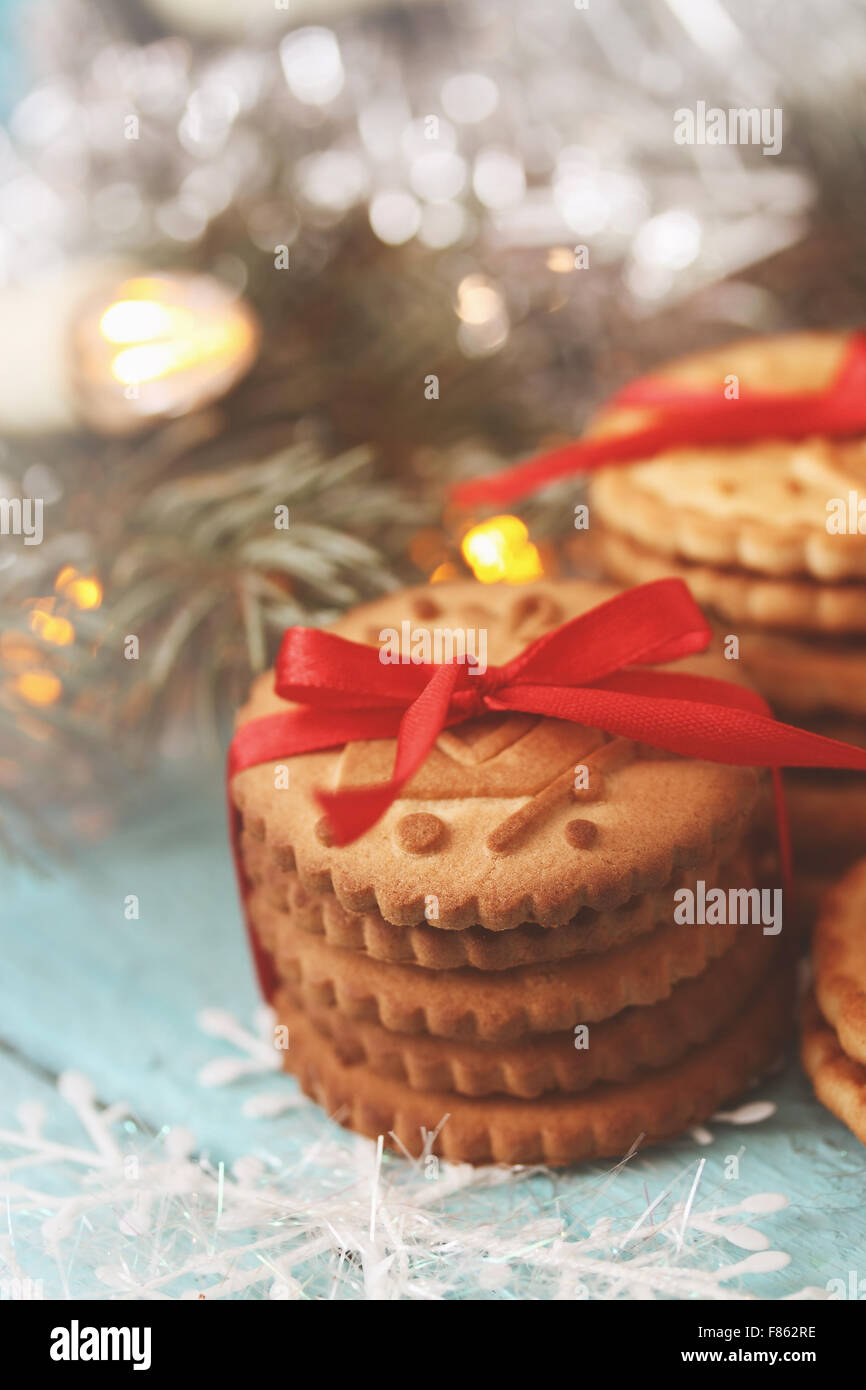 stack of cookies with a red bow, tinted Stock Photo - Alamy