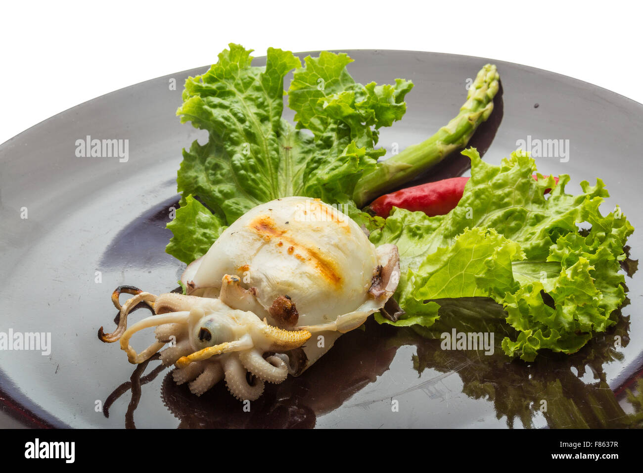Grilled cuttlefish with salad and pepper Stock Photo - Alamy