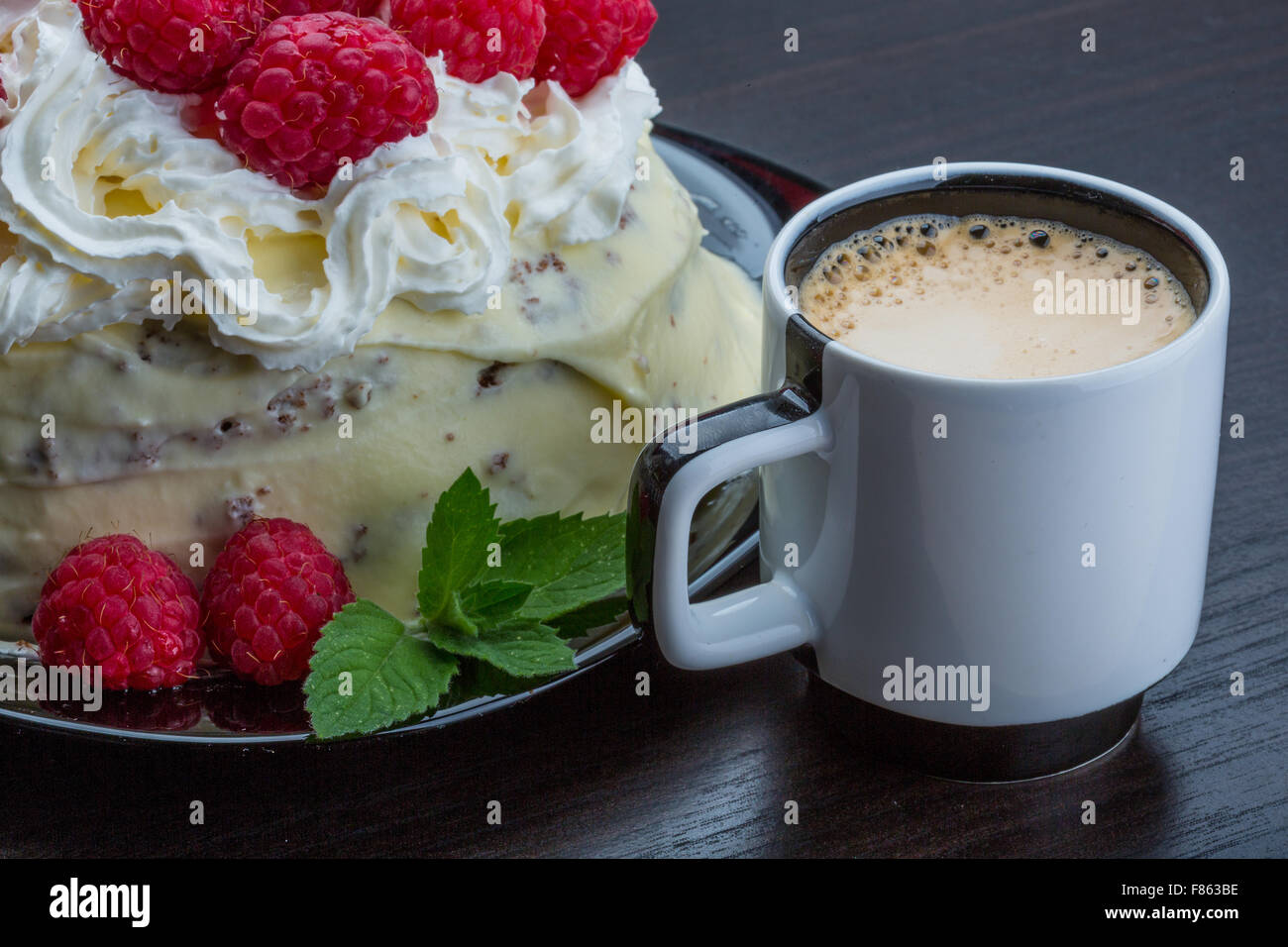 Coffee with raspberry cake and mint Stock Photo - Alamy