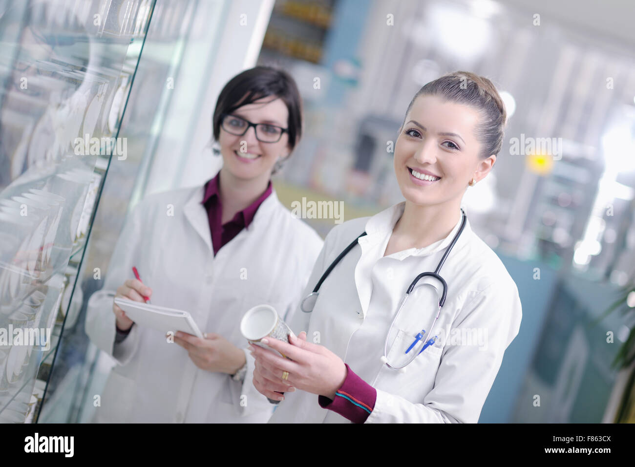 team of pharmacist chemist woman group standing in pharmacy drugstore ...