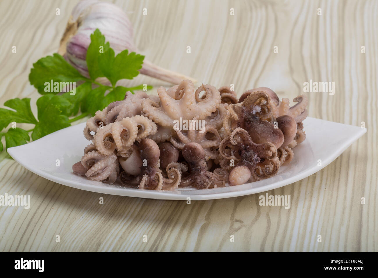 Boiled octopus - mini seafood in the bowl Stock Photo - Alamy